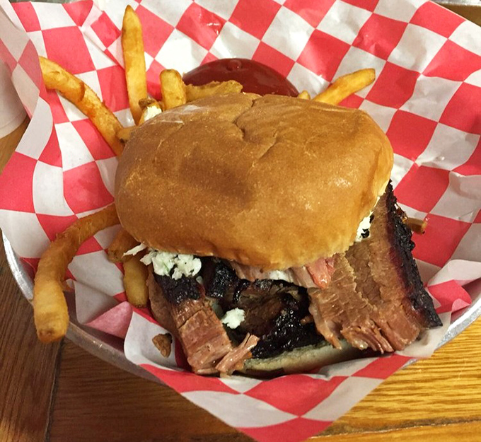 This brisket sandwich isn't just a meal, it's a life event—complete with the kind of bark that makes tree bark jealous.