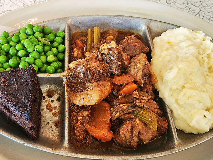 Comfort food that means business&mdash;tender brisket swimming in rich gravy alongside bright peas and cloud-like mashed potatoes. TV dinners wish they grew up to be this.