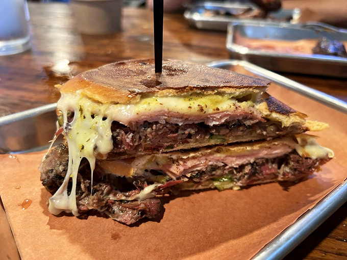 Behold the brisket sandwich that launches a thousand road trips - tender, smoky perfection between two slices.