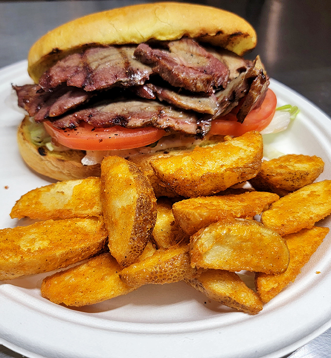 This brisket sandwich isn't just a meal, it's a masterclass in patience&mdash;thin-sliced beef with a bark so perfect it deserves its own standing ovation.