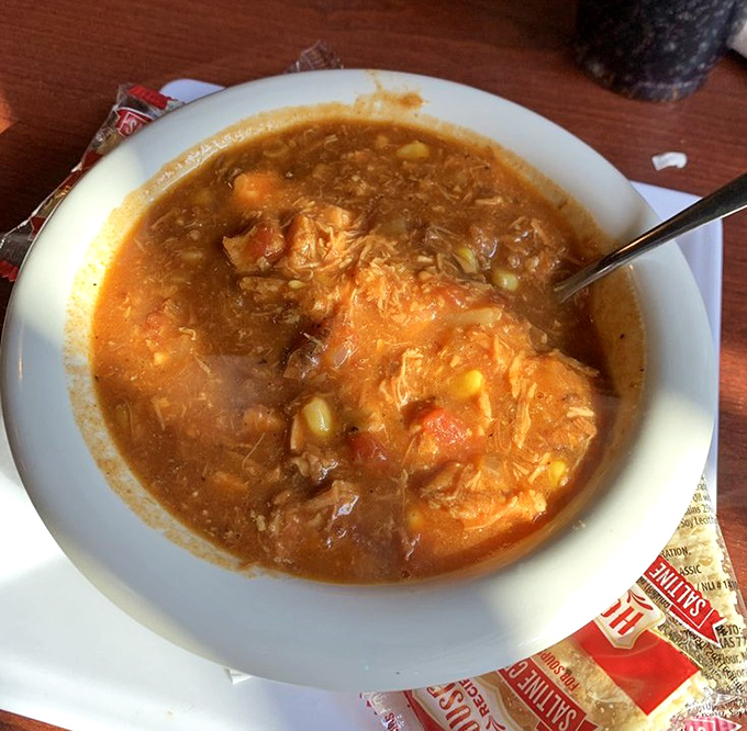Brunswick stew that could make a vegetarian weep with temptation. This hearty bowl combines tender meat, vegetables, and decades of know-how into Georgia's ultimate comfort food.