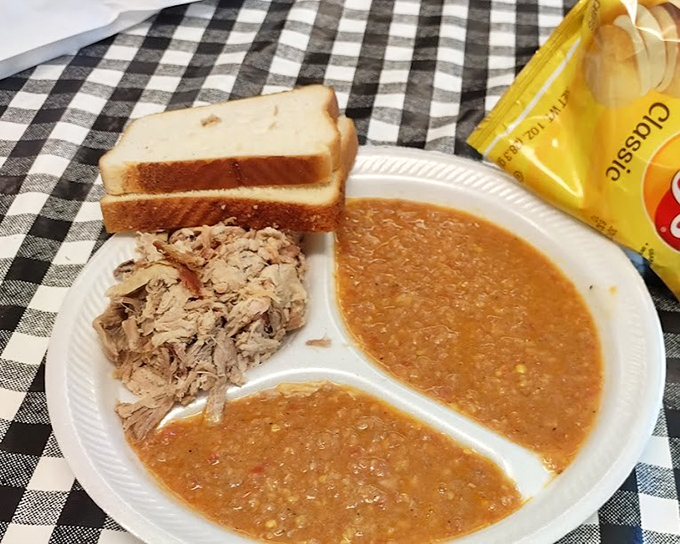 Brunswick stew so thick your spoon might stand at attention, paired with pulled pork that practically begs to be introduced to that slice of white bread.