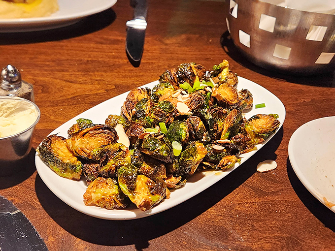 These aren't your childhood Brussels sprouts. Caramelized to perfection with crispy edges that would make potato chips jealous, they're the vegetable equivalent of a standing ovation.