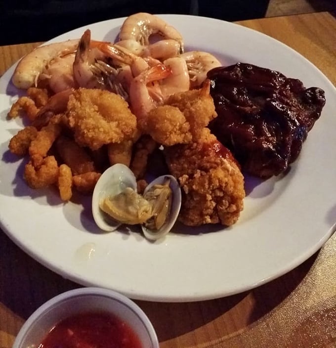 A plate that answers the eternal question: "Why choose one when you can have it all?" Shrimp, fried seafood, and BBQ ribs create the ultimate land-and-sea alliance.