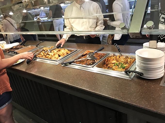 The buffet line&mdash;where decisions get tough and plates get full. Each tray holds another reason to loosen your belt before you even sit down.