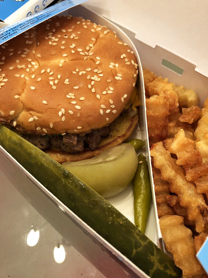 This isn't just a burger – it's a masterclass in simplicity, where every element from the pickle to the poppy seed bun plays its part perfectly.