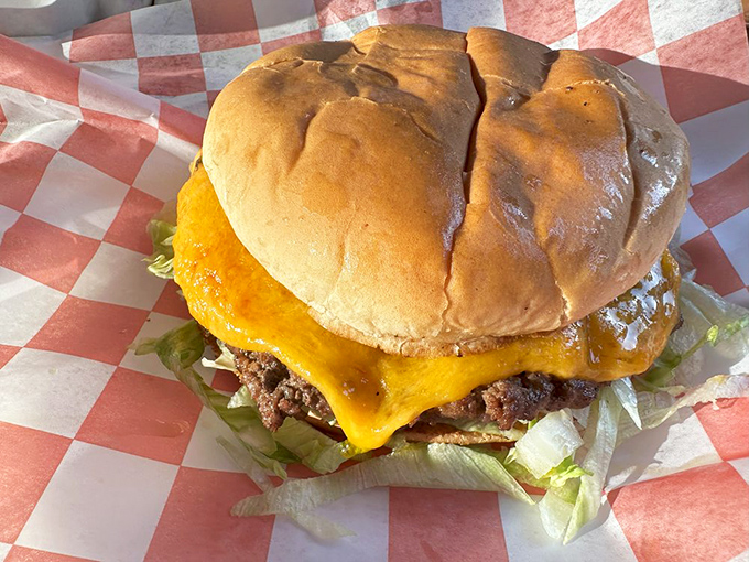 Behold the cheese waterfall! This isn't just a cheeseburger; it's performance art with a bun backstage.