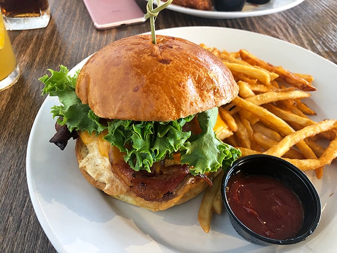This isn't just a burger; it's an architectural masterpiece of beef, bun, and garden-fresh toppings. The fries aren't sidekicks &ndash; they're co-stars in this delicious production.