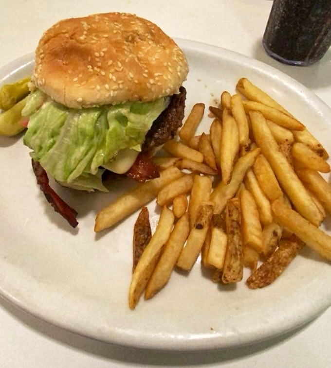 This isn't just a burger&mdash;it's edible nostalgia. The perfect ratio of meat to bun to toppings, with fries that deserve their own fan club.