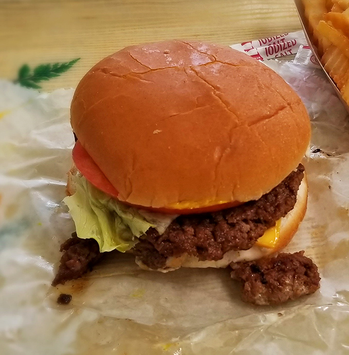 The star of the show in all its glory&mdash;a hand-formed patty on a pillowy bun that's worth every mile of the journey.