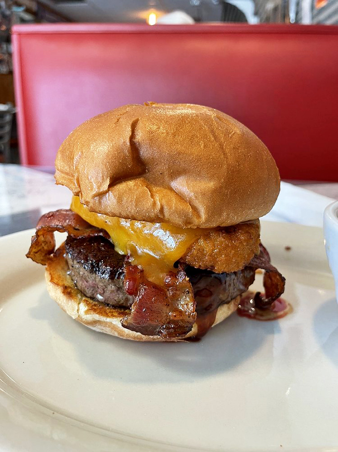 This isn't just a burger&mdash;it's a masterpiece of melted cheese cascading over perfectly seared beef, demanding both napkins and respect.