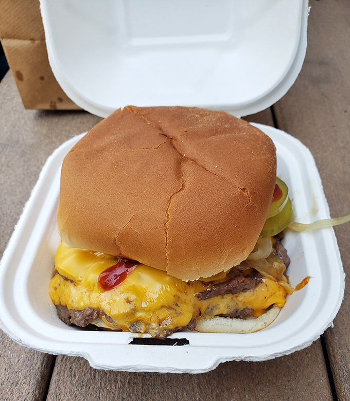 Behold the cheese-draped masterpiece that's drawn pilgrims from across the Midwest. No pretentious garnishes, just pure burger bliss in its natural habitat.