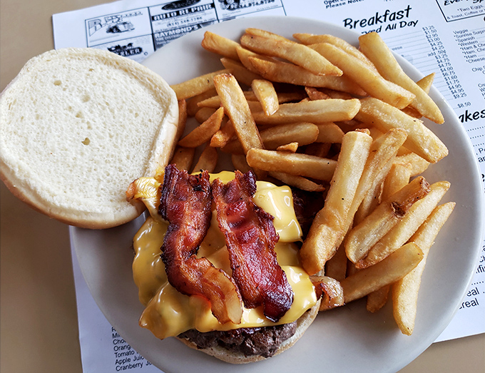 The bacon cheeseburger arrives like a work of art &ndash; crispy, glistening bacon draped over melted cheese on a perfectly charred patty.