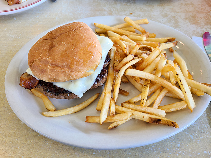 Behold, the star of our show! This burger doesn't need fancy toppings or a clever name&mdash;just perfectly seasoned beef, melty cheese, and fries that demand to be devoured.