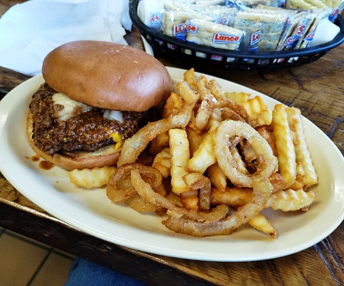 This burger doesn't need a fancy name or artisanal description. The perfectly seared patty, golden fries, and crispy onion rings speak a universal language of satisfaction.
