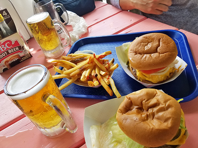 The holy trinity of vacation happiness: cold beer, golden fries, and burgers that make you question why you ever ate anywhere else.