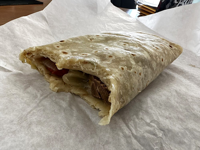 Behold the humble hero &ndash; a green chili burrito in its natural habitat. That perfectly browned tortilla is just the beginning of a beautiful relationship.