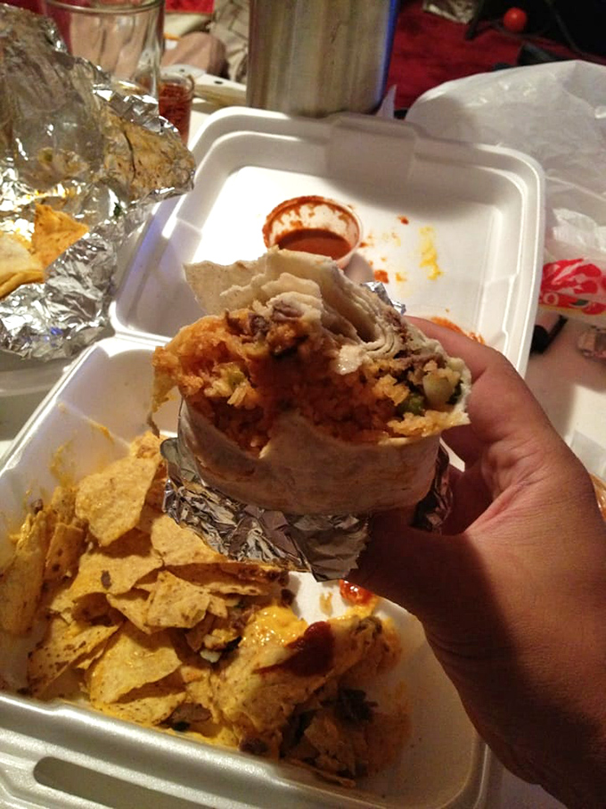 Behold the burrito in its natural habitat&mdash;halfway between the wrapper and someone's mouth. The proper way to experience this masterpiece.