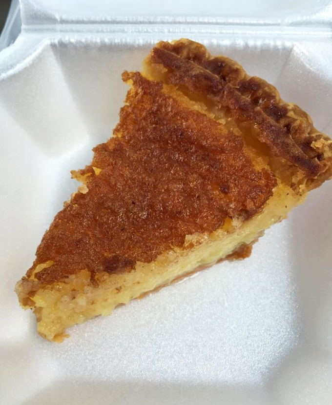 Behold the legendary buttermilk pie in all its caramelized glory. This isn't dessert; it's an edible Southern heirloom that Ben Affleck made famous.