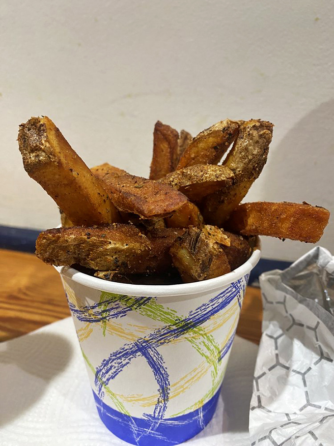 These aren't just fries; they're golden potato pillars dusted with spices that make regular fries look like they're not even trying.