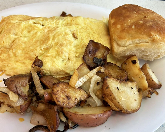 This Cajun omelet arrives like sunshine on a plate, with home fries that deserve their own fan club.