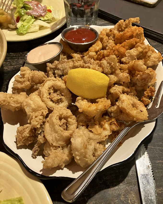 Golden, crispy perfection! This mountain of Calamari Fritti isn't just an appetizer&mdash;it's the reason some folks drive across state lines.