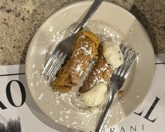 These cannolis aren't just dessert, they're an event. Crispy shells, creamy filling, and a dusting of powdered sugar that will definitely end up on your shirt.