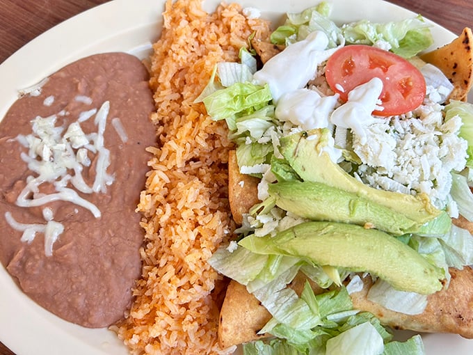 This isn't just a plate; it's a masterpiece of Mexican comfort food with beans so creamy they deserve their own fan club.