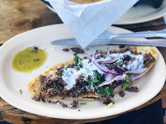 This huarache isn't for your feet—it's a sandal-shaped masa masterpiece topped with perfectly seasoned carne asada, fresh toppings, and a sprinkle of magic.