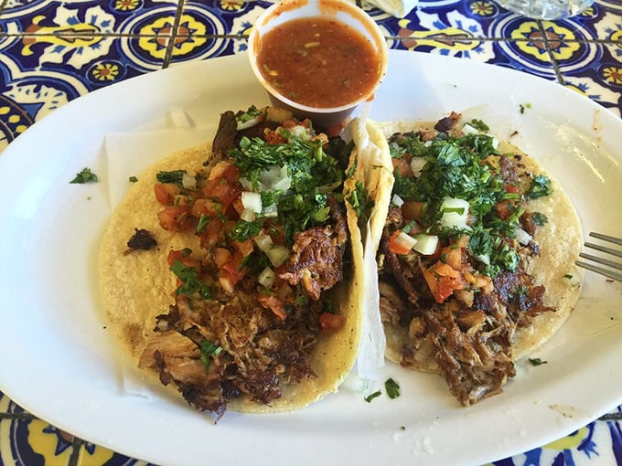 These carnitas tacos aren't just food&mdash;they're an event. Perfectly crisped pork crowned with fresh cilantro and pico de gallo, waiting for that squeeze of lime.