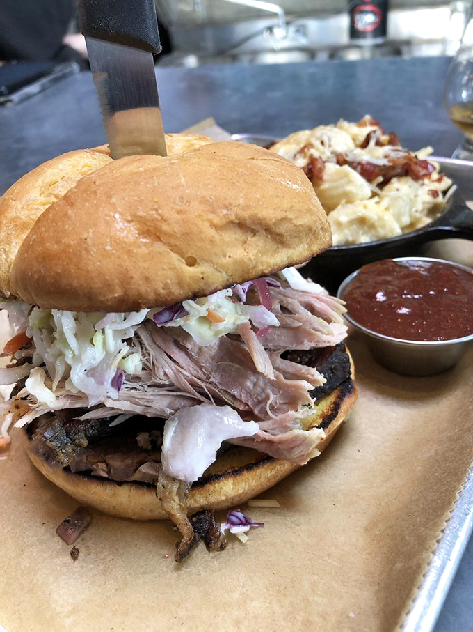 This isn't just a sandwich; it's a masterclass in texture and flavor. The brisket practically whispers "I've been smoking for hours just for you."