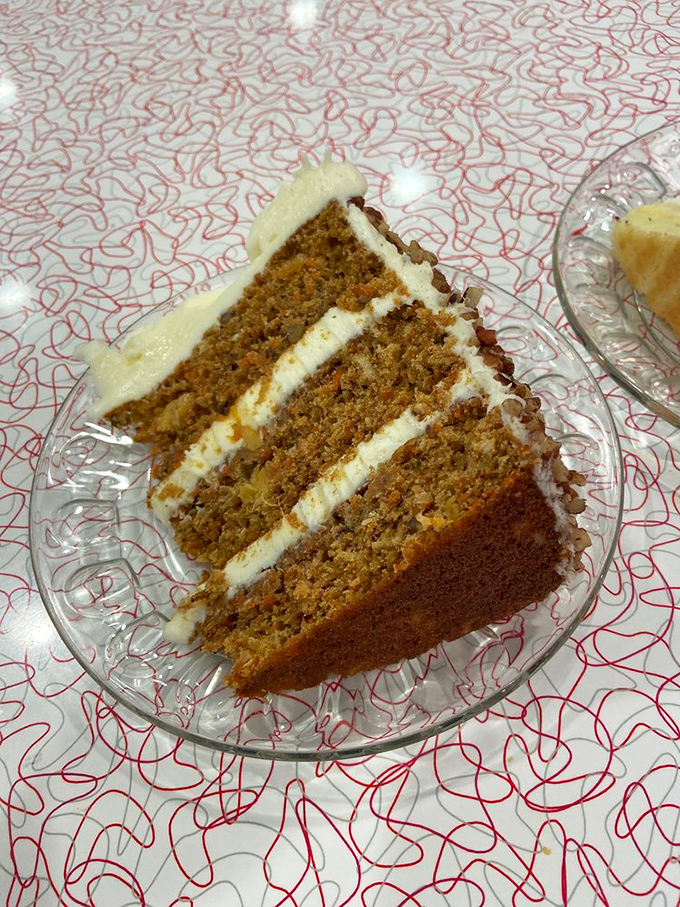 Behold the carrot cake in its natural habitat&mdash;four glorious layers proving vegetables can indeed be the star of dessert.