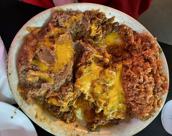 These cheese enchiladas don't just satisfy hunger&mdash;they solve existential crises. The rice isn't a side; it's a supporting actor deserving its own award.