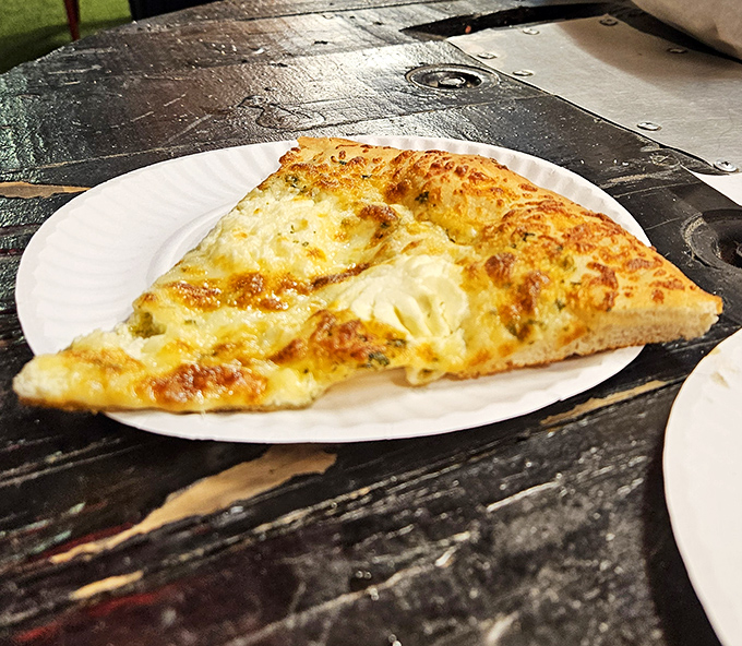 Behold the cheese pull that launched a thousand road trips. This isn't just pizza&mdash;it's Cleveland's edible ambassador to your taste buds.