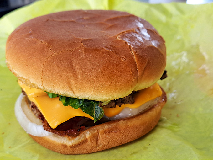 Behold the classic cheeseburger in its natural habitat&mdash;perfectly melted American cheese embracing a hand-formed patty like they were meant to be together.