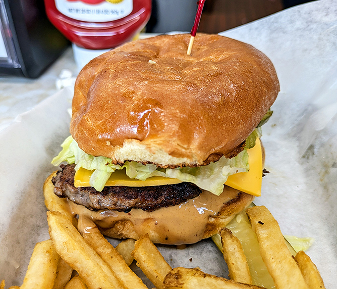 Meet the Duane Purvis All-American—a burger so legendary it deserves its own ZIP code. That peanut butter layer isn't a mistake; it's an epiphany.