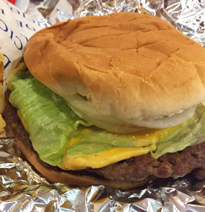 This isn't just a cheeseburger&mdash;it's edible architecture. The perfect ratio of beef to cheese to bun, with lettuce and onion for that essential crunch.
