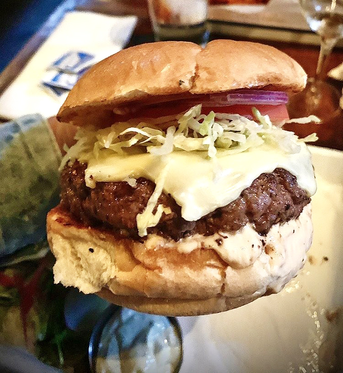 This isn't just a cheeseburger; it's a masterclass in beef architecture where every layer knows its role and plays it perfectly.