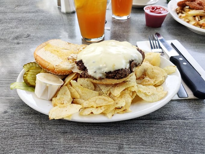 Behold burger perfection: melted cheese cascading down a hand-formed patty, served with crisp chips. This isn't Instagram food&mdash;it's actually delicious food.