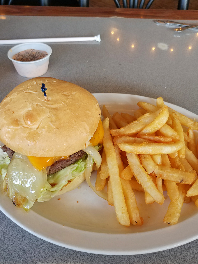 Behold the legendary cheeseburger that locals whisper about &ndash; perfectly melted cheese cascading over a juicy patty with golden fries.