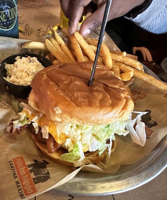 This towering cheeseburger means business &ndash; the kind that requires both hands and zero regrets.