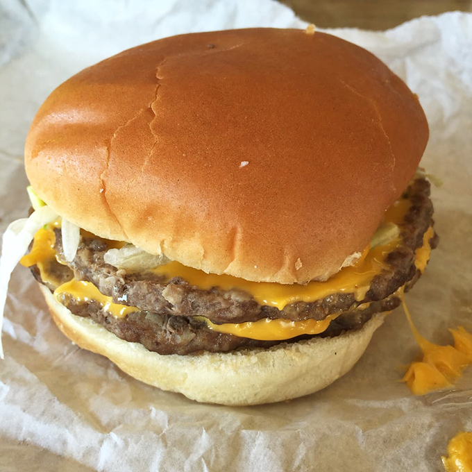 This double cheeseburger isn't trying to impress Instagram&mdash;it's too busy preparing to impress your taste buds with its perfectly melted cheese and juicy patties.