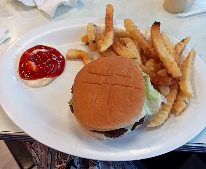 This isn't just a burger&mdash;it's edible nostalgia on a bun, served with crinkle-cut fries that crunch like childhood memories.