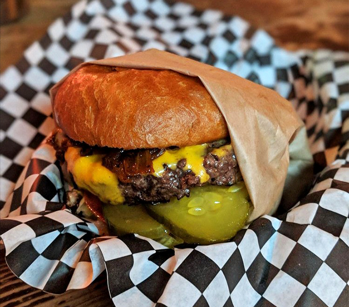 This isn't just a burger; it's a juicy manifesto of beef, melted cheese, and pickles that demands to be devoured immediately.
