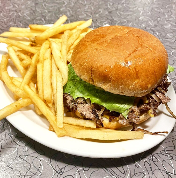 This isn't just a cheeseburger and fries&mdash;it's edible poetry on a plate. The kind of simple perfection that makes you question why anyone would complicate food.