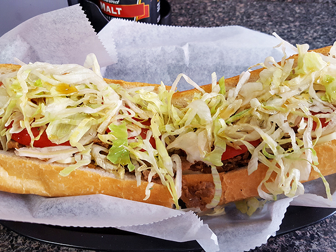 Behold the holy trinity of cheesesteak perfection: tender meat, melted cheese, and fresh toppings cradled in a roll sent from sandwich heaven.