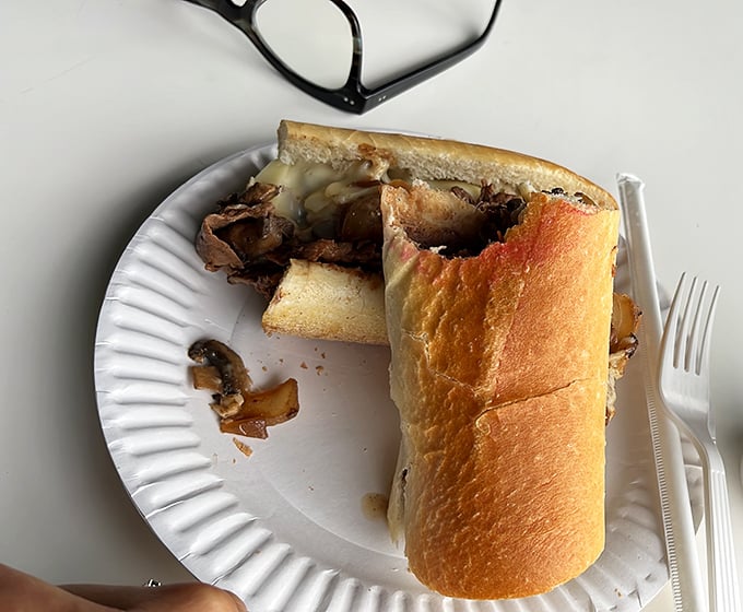 Behold the star of the show! Thinly sliced ribeye piled high with perfectly melted cheese&mdash;this isn't just a sandwich, it's an edible work of art.