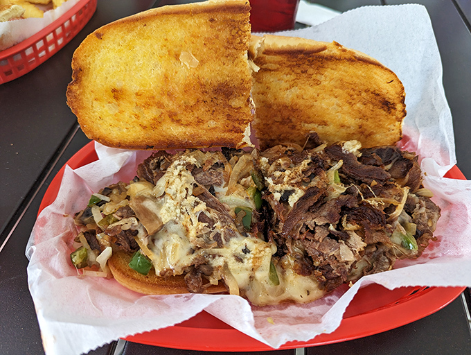 This isn't just a cheesesteak; it's a masterclass in sandwich architecture. Toasted bread, melty cheese, and tender meat creating perfect harmony.