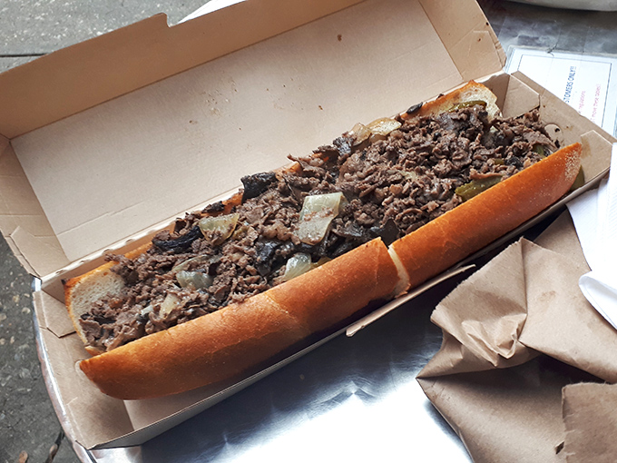 Behold the star of the show: thinly sliced ribeye piled high with perfectly caramelized onions. This isn't just a sandwich; it's Philadelphia's soul between bread.