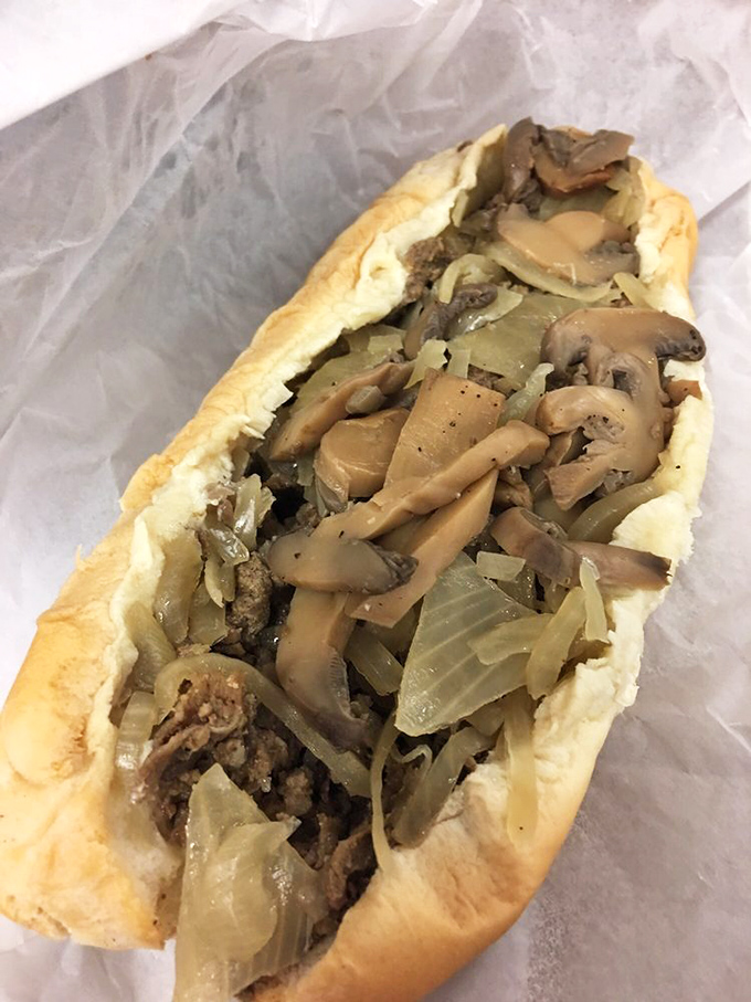 Mushrooms, onions, and beef living their best lives together. This cheesesteak isn't just a sandwich&mdash;it's a beautiful relationship.